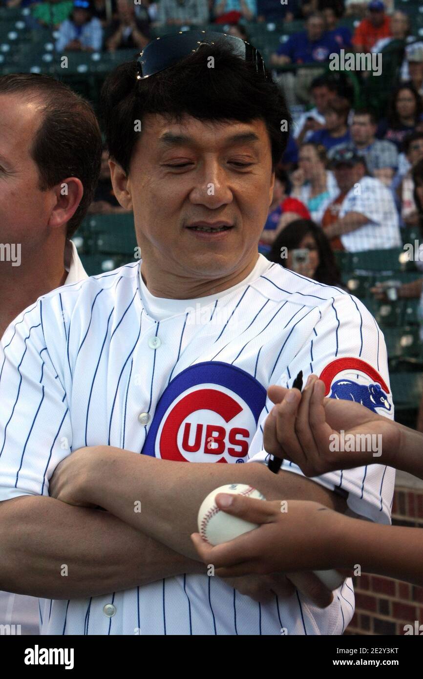 Jacky Chan with fans before he throws out the first pitch at the ...