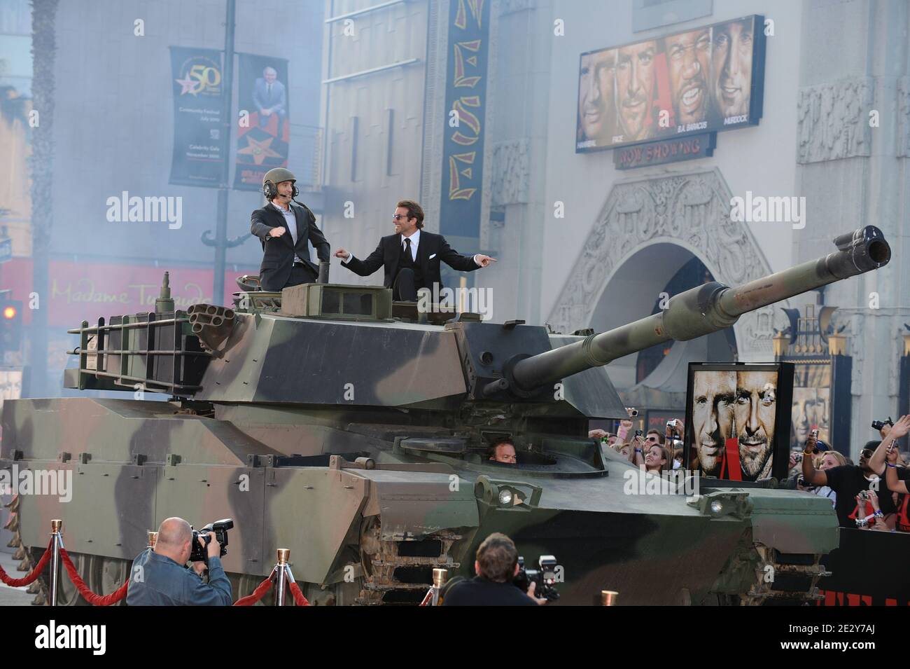 Sharlto Copley (L) and Bradley Cooper arriving on a tank for the L.A ...