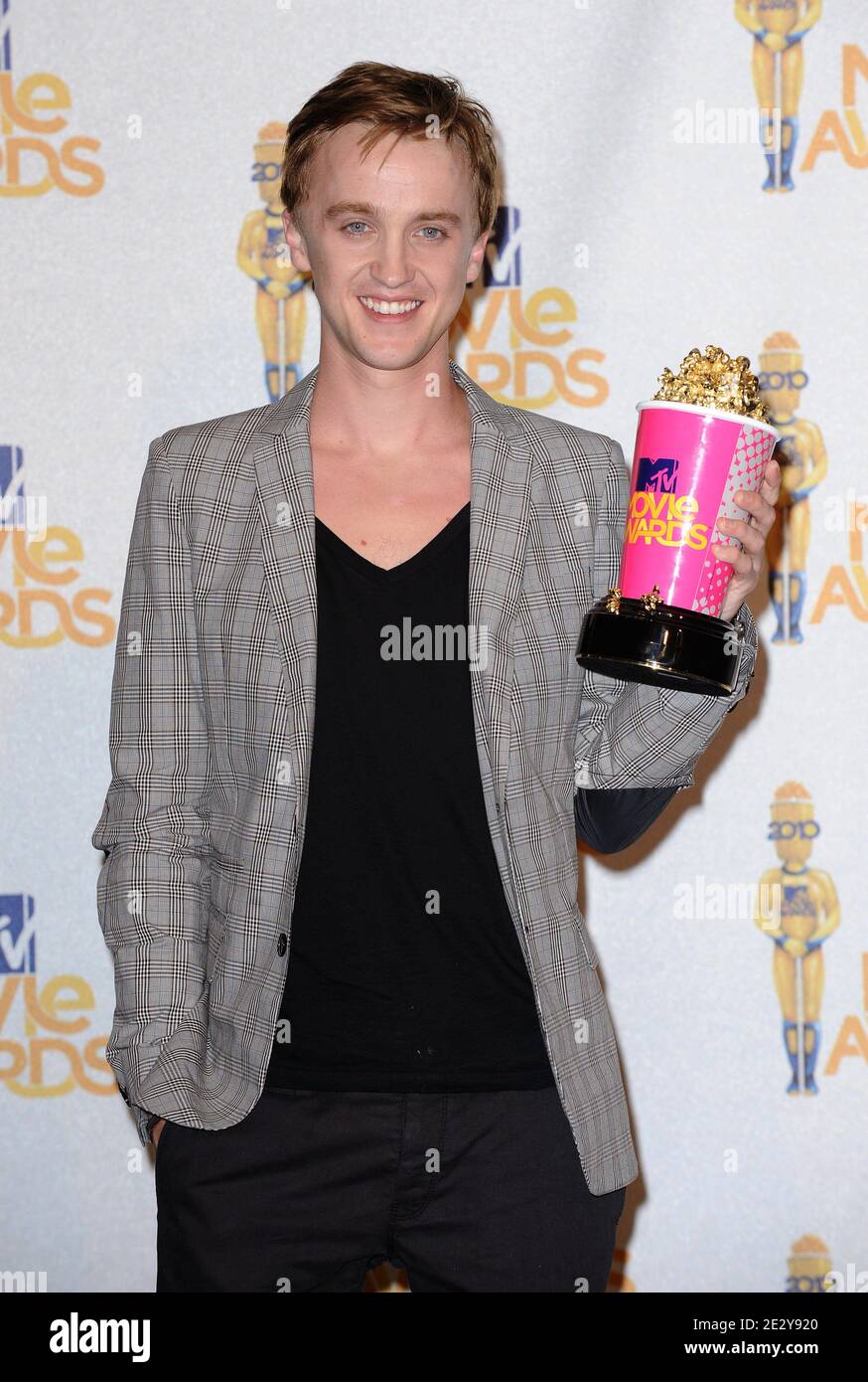 Tom Felton poses in the press room of the 2010 MTV Movie Awards held at ...