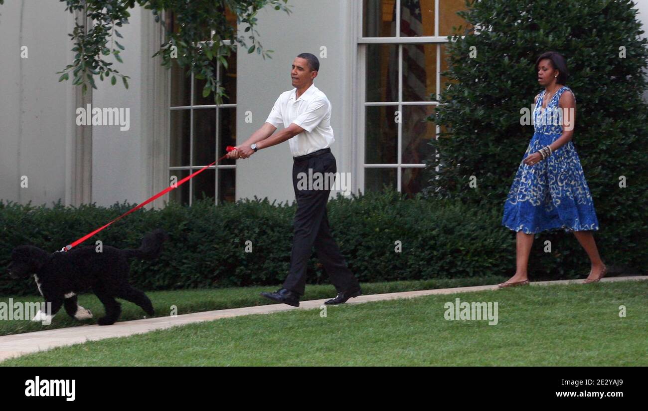 United States President Barack Obama and First Lady Michelle Obama walk ...