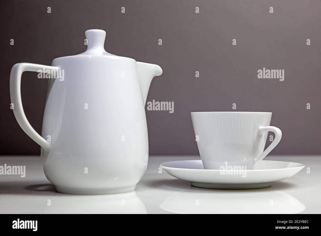 white coffeepot and cup isolated Stock Photo - Alamy
