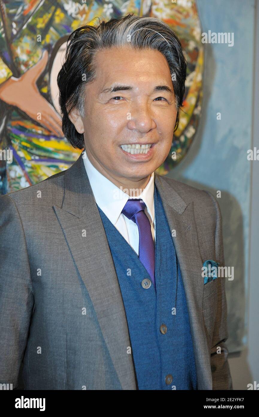 Japanese designer Kenzo Takada, aka 'Kenzo', poses in front of one of ...