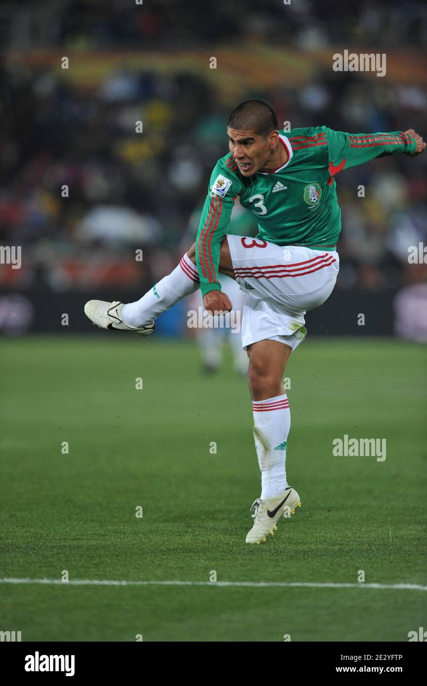 Mexico's Carlos Salcido takes a kick during the 2010 FIFA World Cup ...