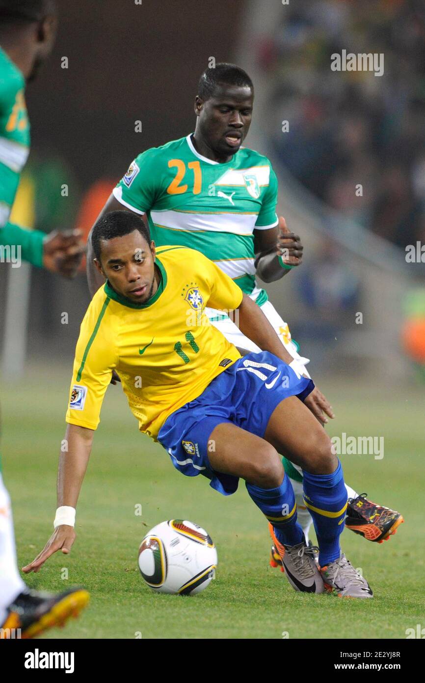 Brazil's Robinho battles Ivory Coast's Emmanuel Eboue during the 2010 ...