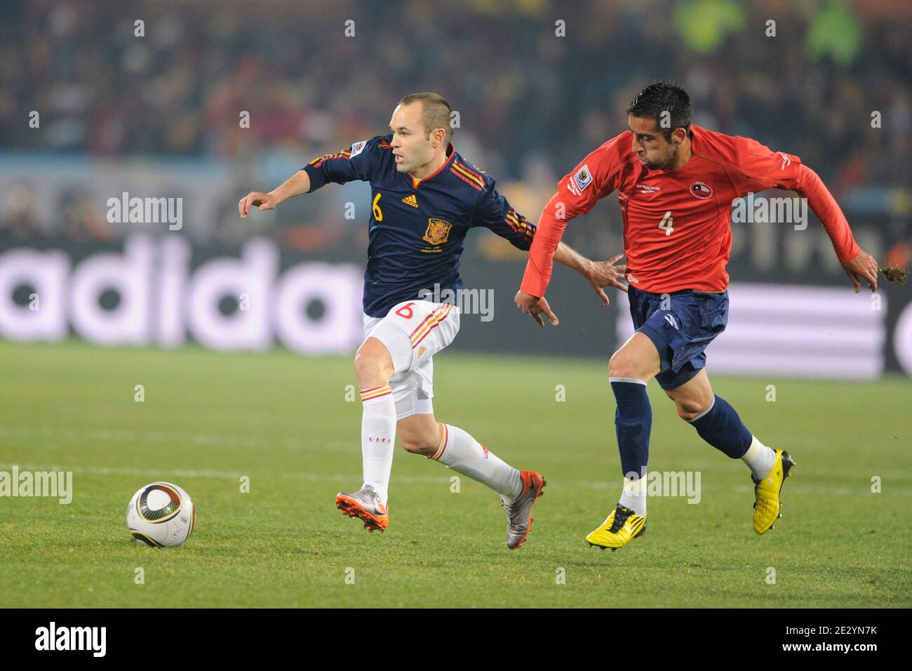 Spain's Andres Iniesta battles Chile's Mauricio Isla during the 2010 ...