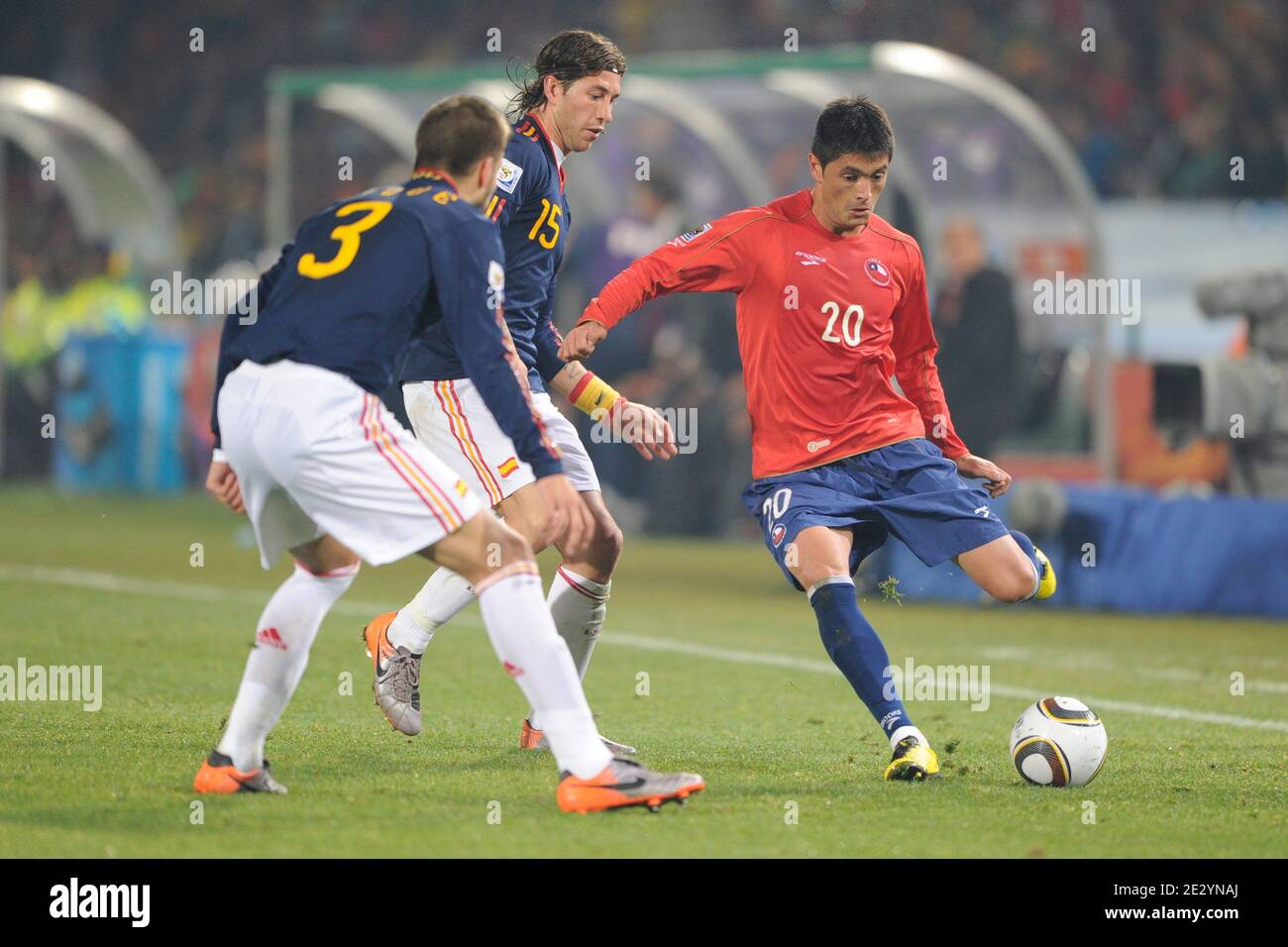 Spain's Gerard Pique and Sergio Ramos battles Chile's Rodrigo Millar ...