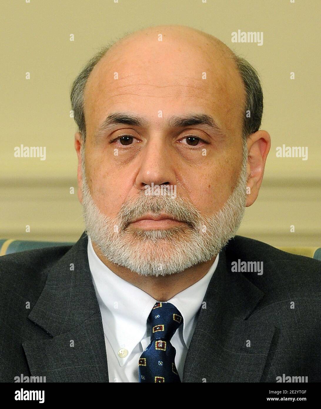 Federal Reserve Board Chairman Ben Bernanke looks on as US President ...