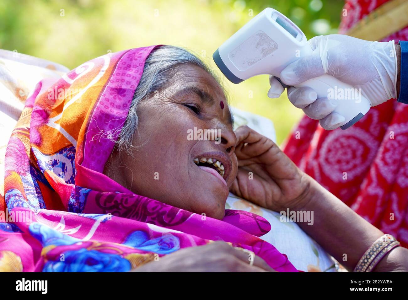 Doctor's hand measuring the body temperature of the patient with a ...