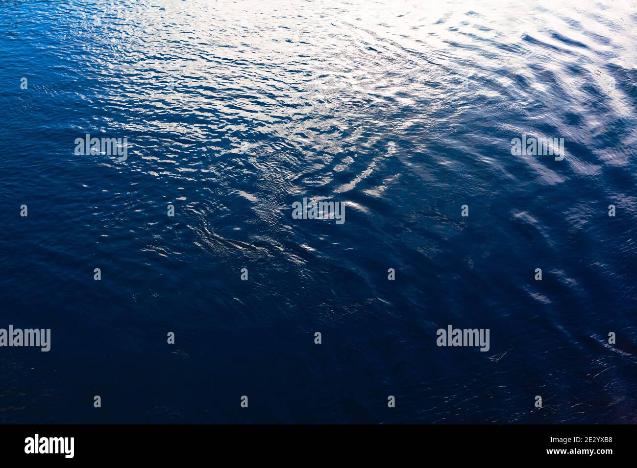 Blue water surface with sunlight reflection . Ripple on the lake Stock ...