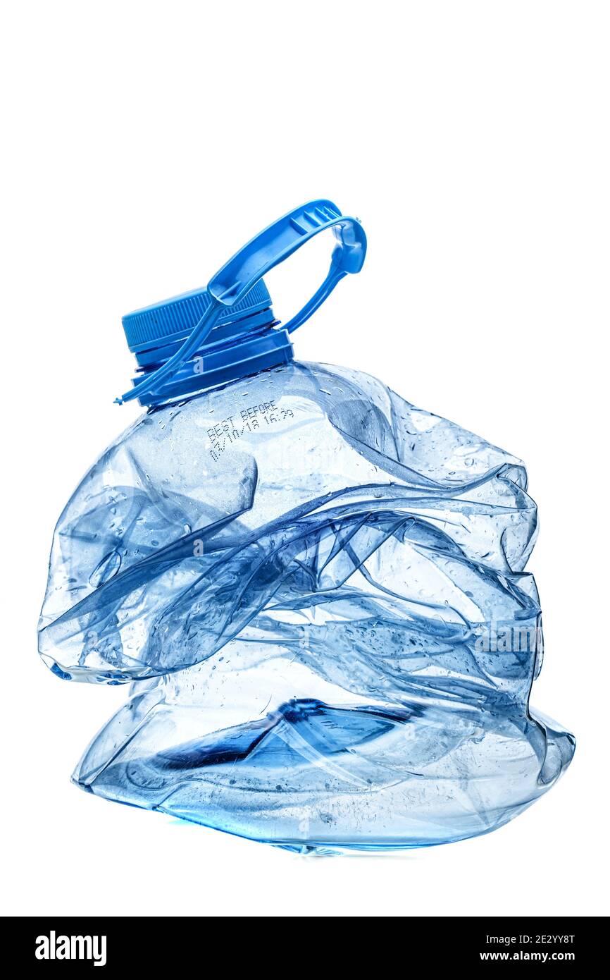 smashed empty plastic bottle with blue cap, isolated on white ...