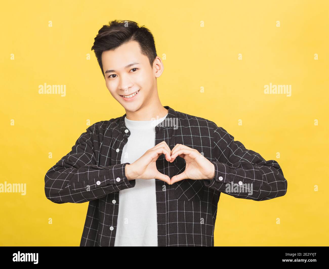 Handsome guy showing heart man hi-res stock photography and images - Alamy
