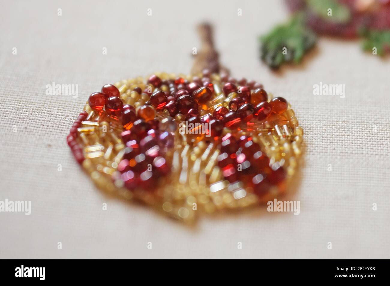 Couture embroidery of pomegranate. Still life with fruits Stock Photo ...