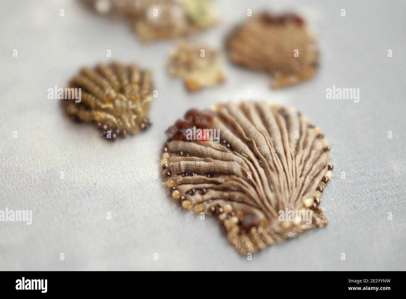 Couture embroidery of sea shells Stock Photo - Alamy