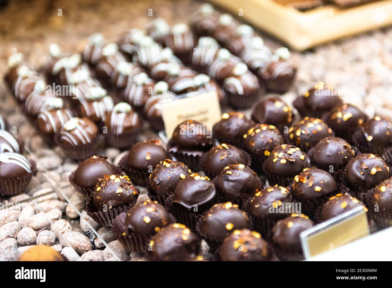 Small cakes in large quantities. Chocolate candies with nut crumbs ...