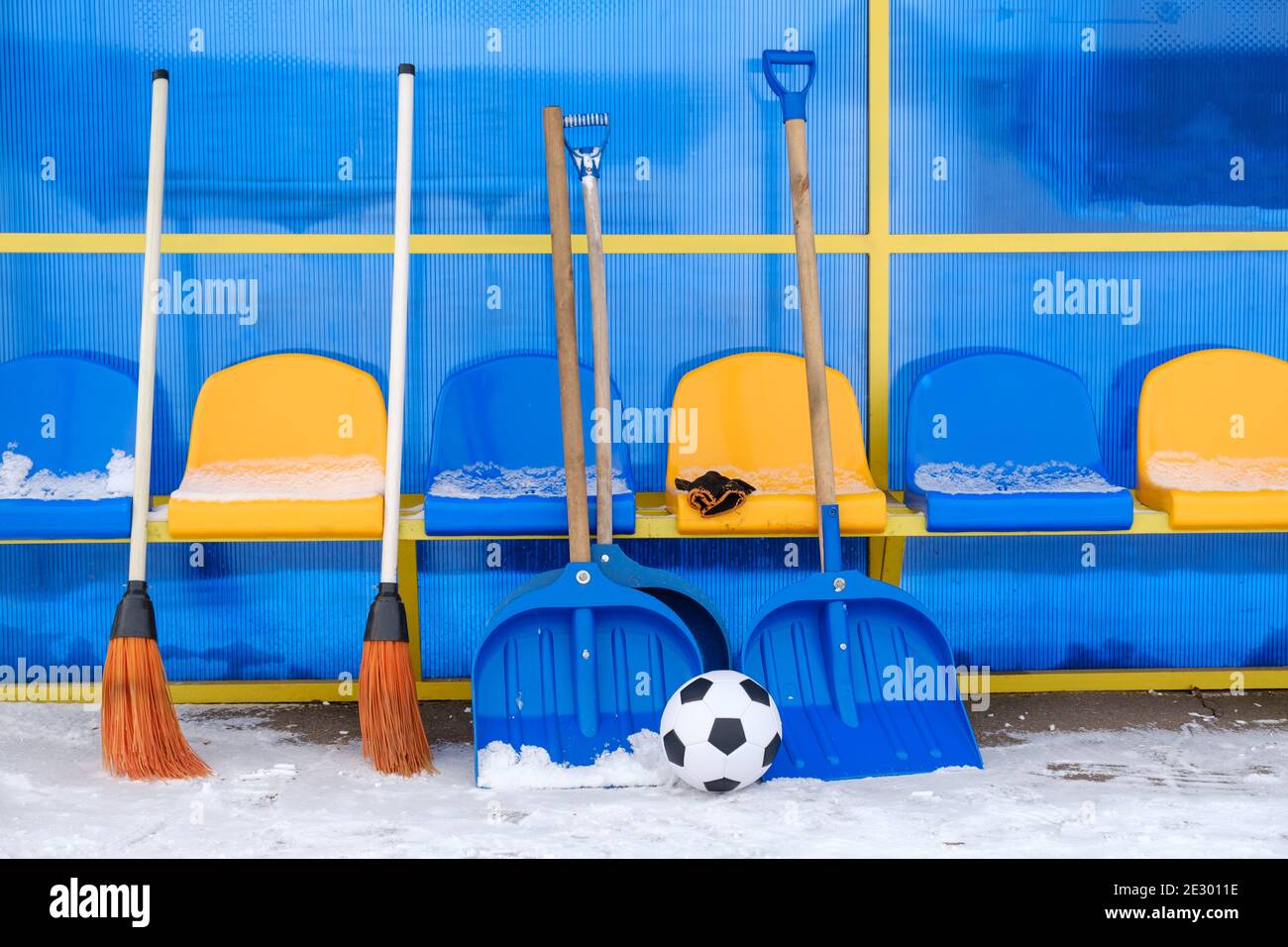Snow-covered substitute bench and tools for clearing snow Stock Photo ...
