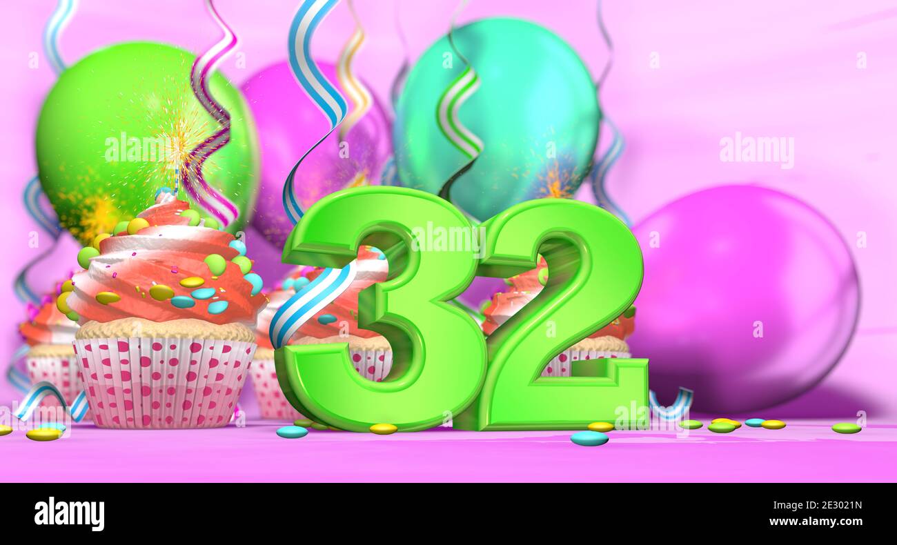Birthday cupcake with sparking candle with the number 32 large in green ...