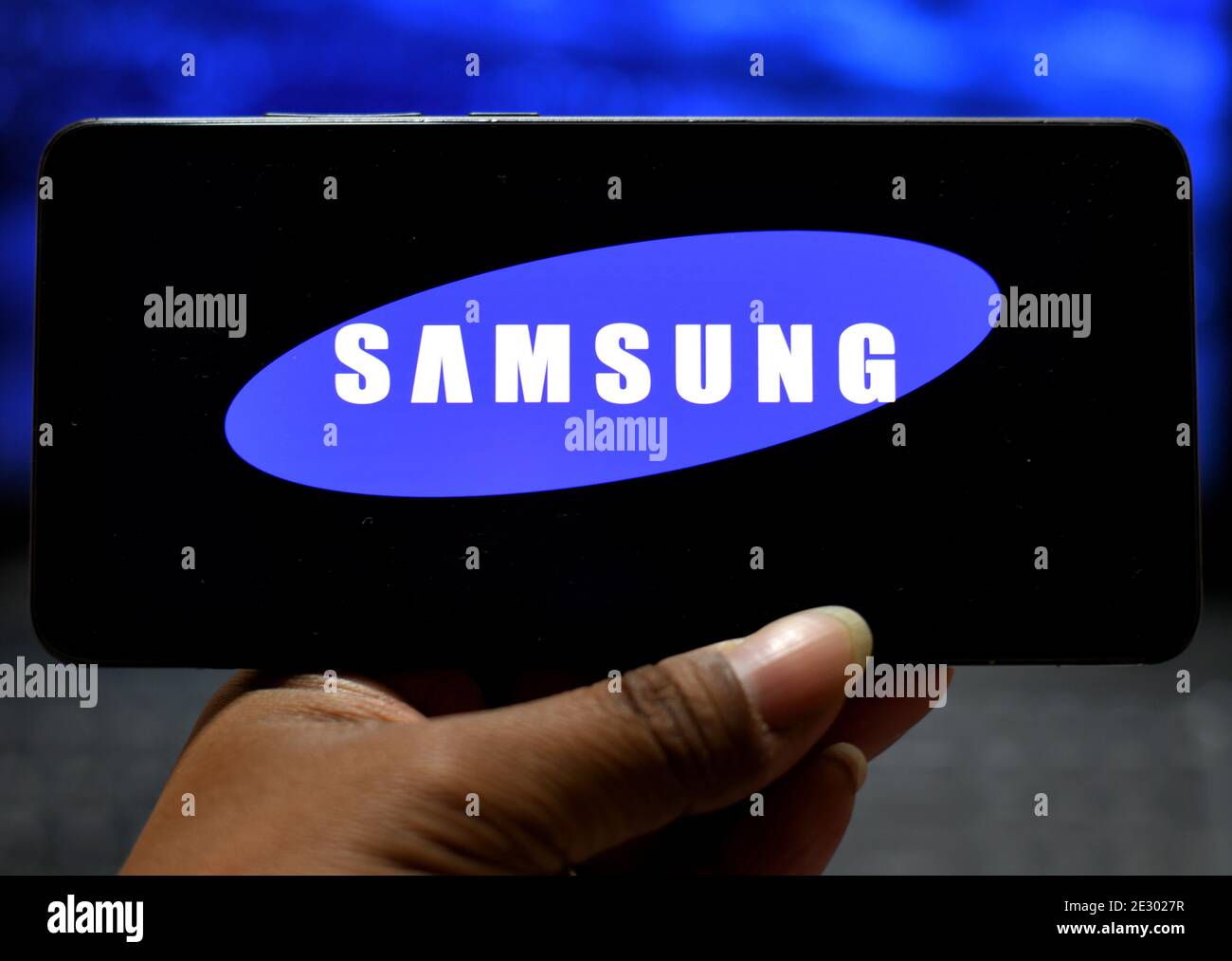 In this photo illustration a Samsung logo seen displayed on a ...