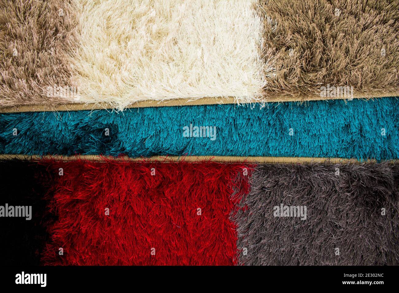 Group of three colorful carpets stacked Stock Photo - Alamy