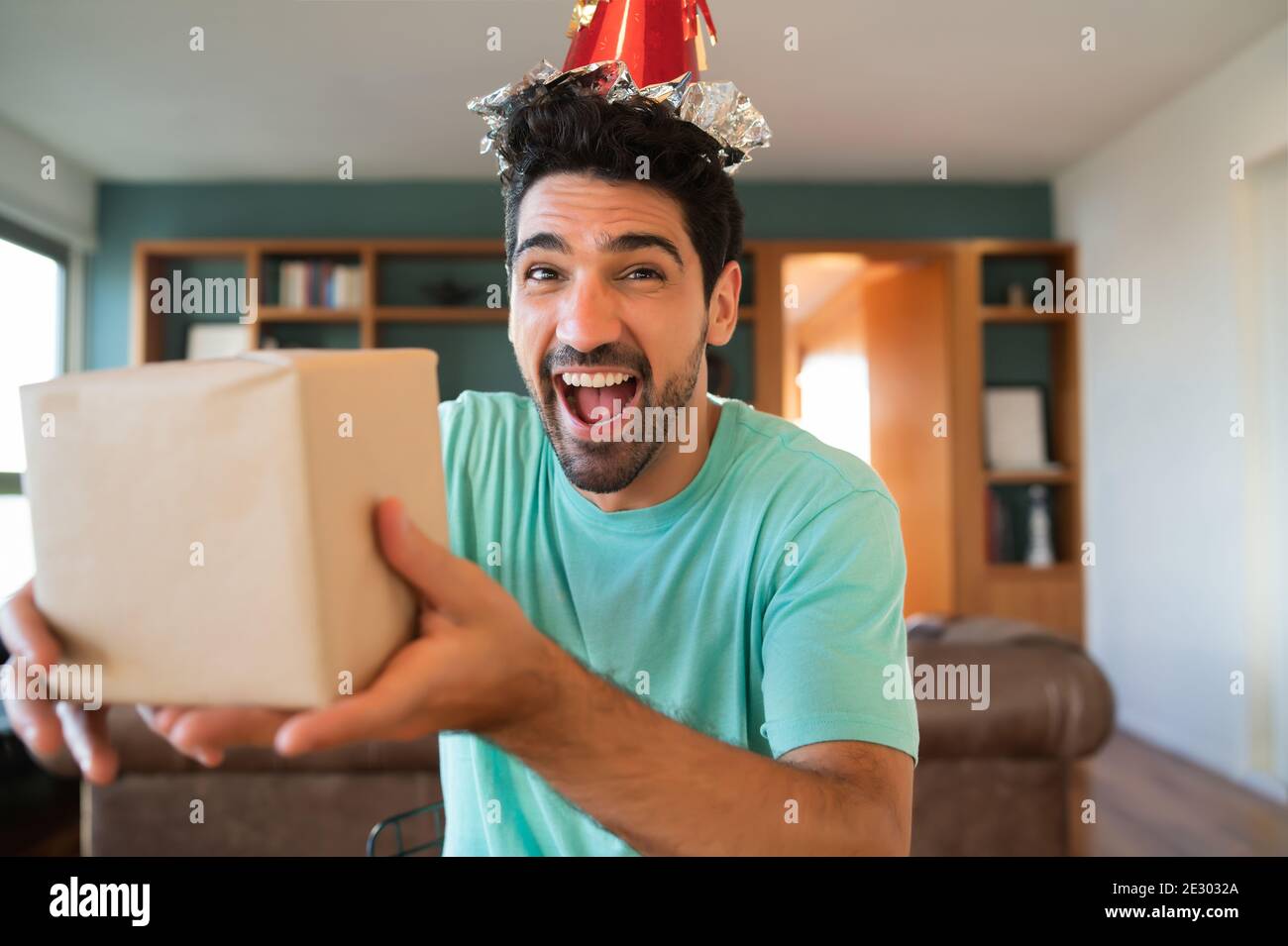 Man celebrating his birthday on a video call Stock Photo - Alamy