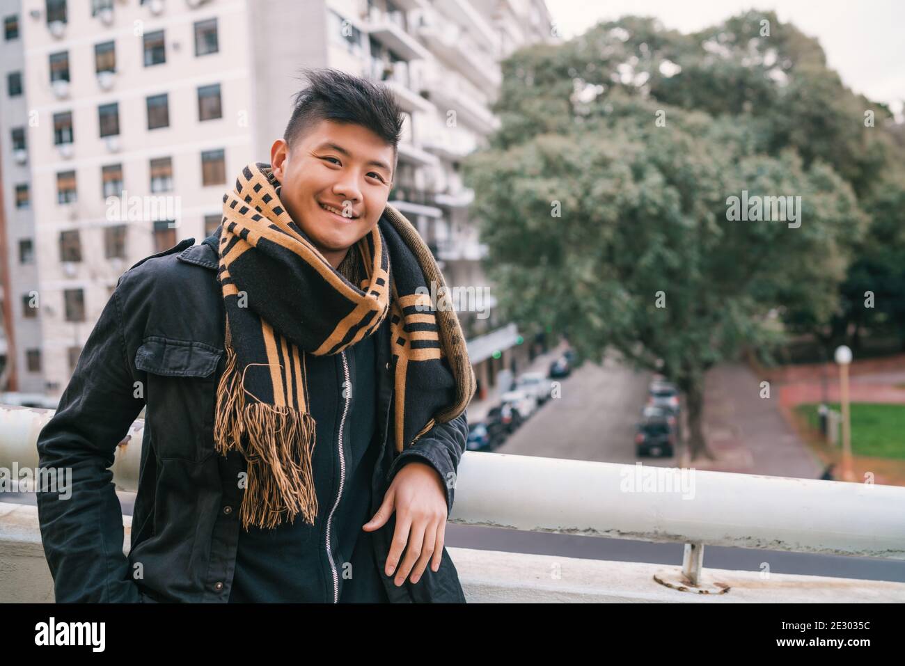 Portrait of young Asian man outdoors Stock Photo - Alamy