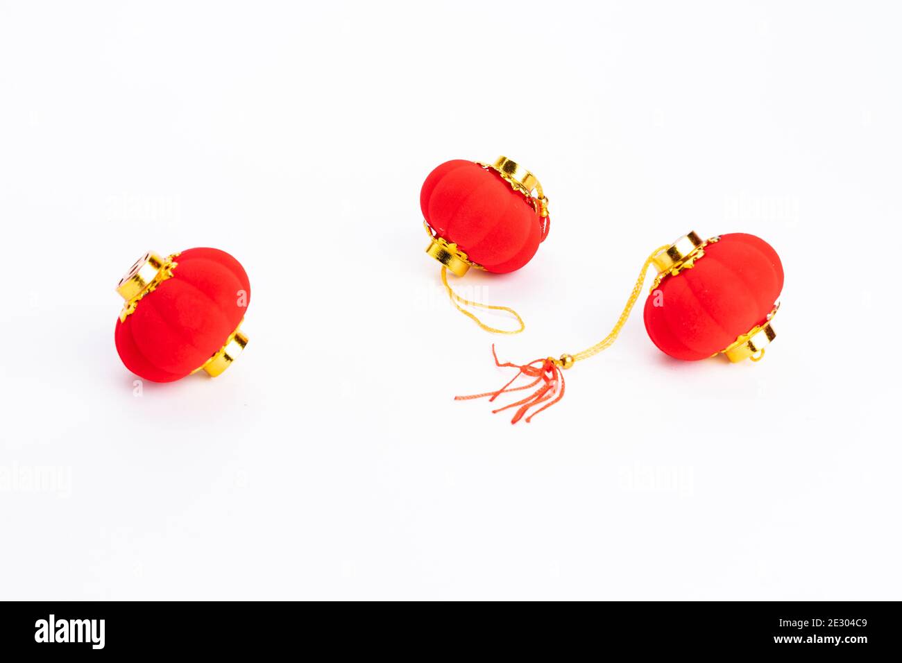 Red Miniature Chinese lantern isolated on white Stock Photo - Alamy