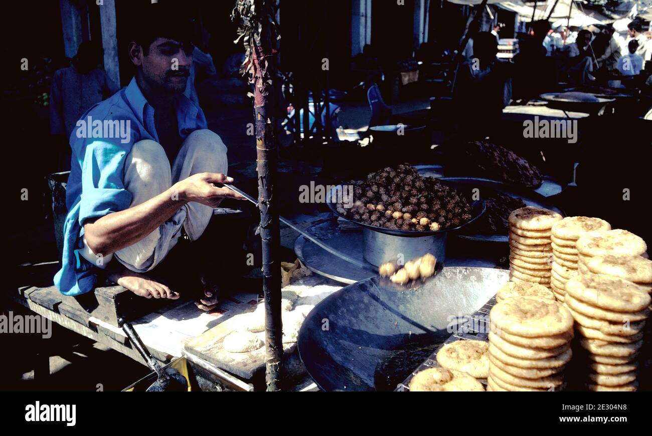 Street food, man cooking pakoras, Pakistan Stock Photo - Alamy