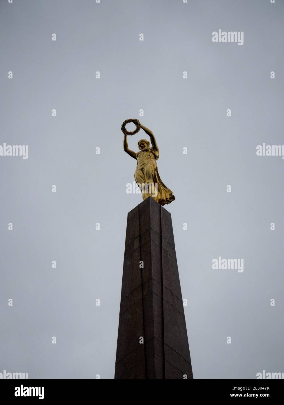 Closeup view of historic war memorial monument of remembrance golden ...