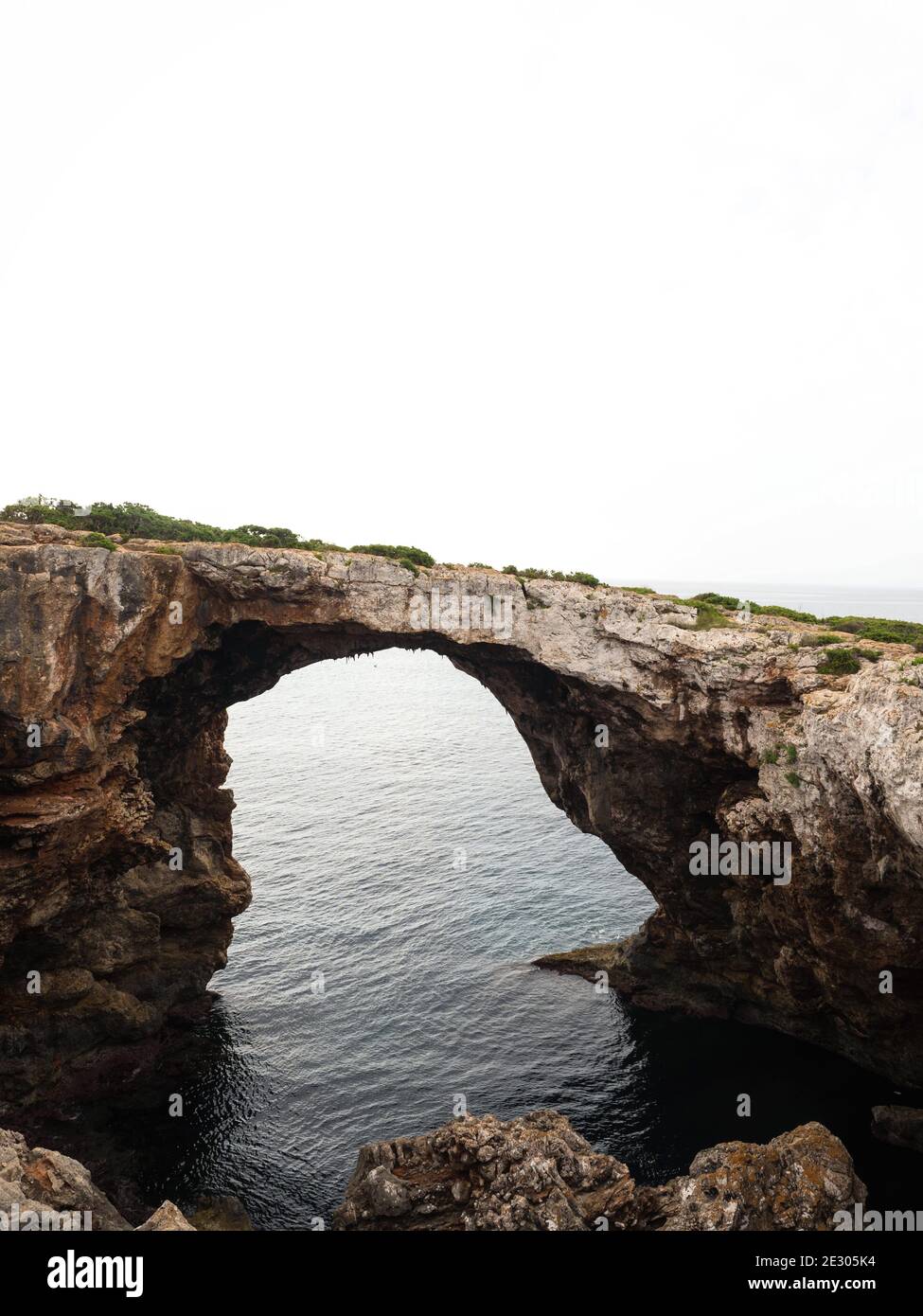 Panorama view of natural arch rock bridge at Cala Varques Calo Blanc ...