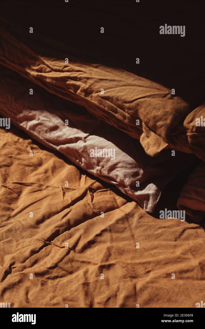 Burnt orange rust coloured sheets bedding texture Stock Photo - Alamy