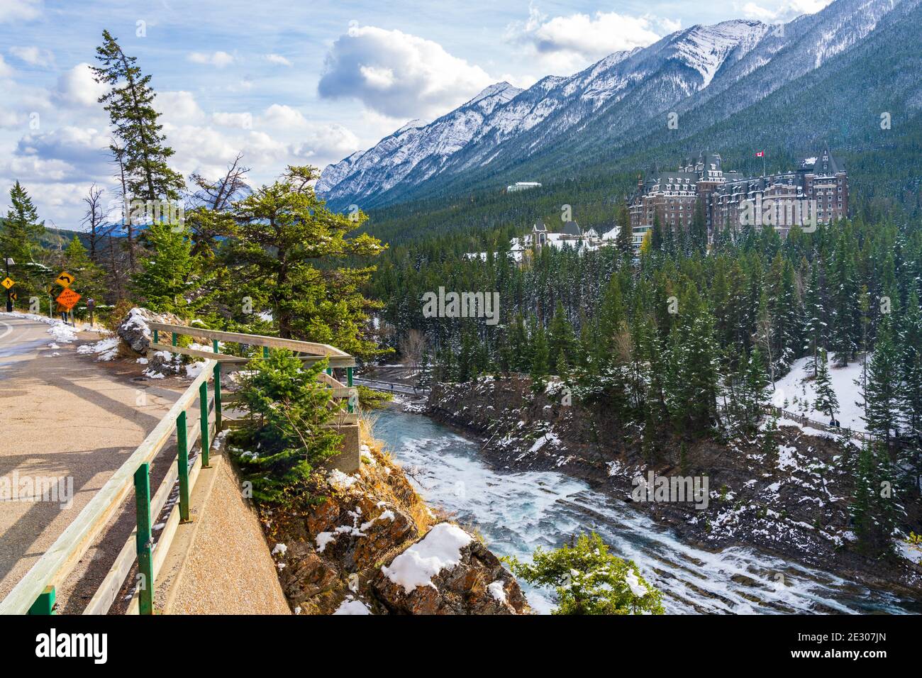 Fairmont Banff Springs and Bow River Falls in snowy autumn sunny day ...