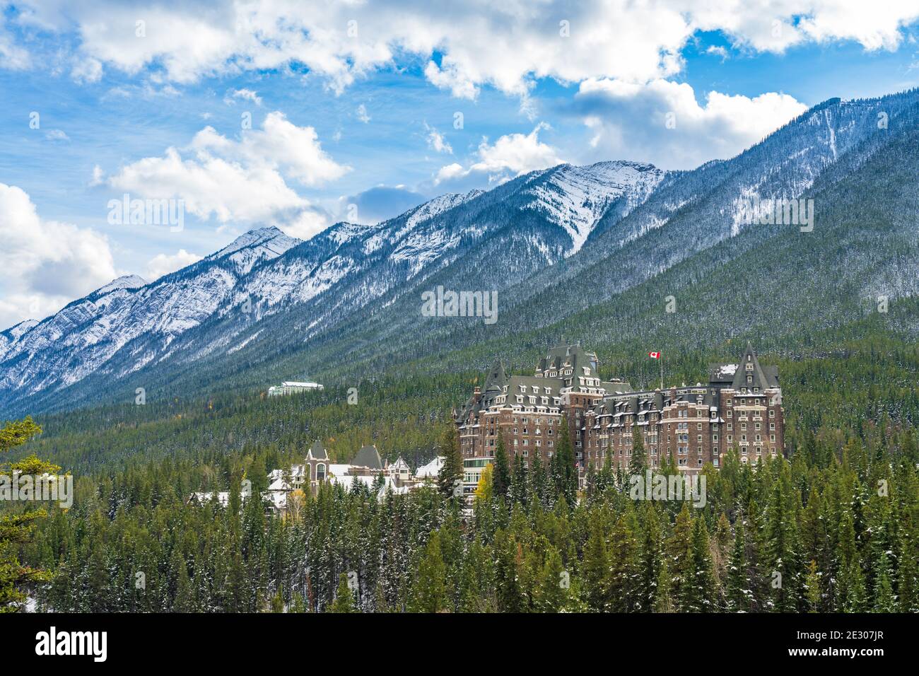 Fairmont Banff Springs in snowy autumn sunny day. View from Surprise ...