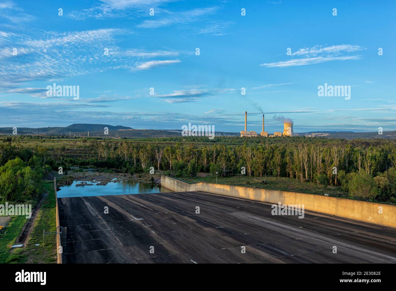 Spillway of the Callide Dam with Callide Coal Power Plant in the ...