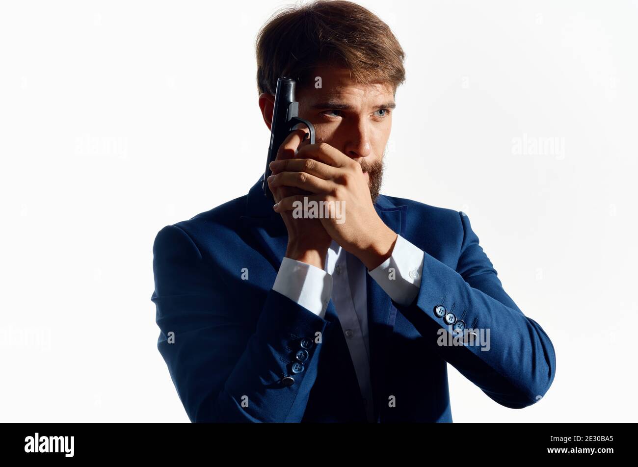 man in suit holding a gun detective crime isolated background Stock ...