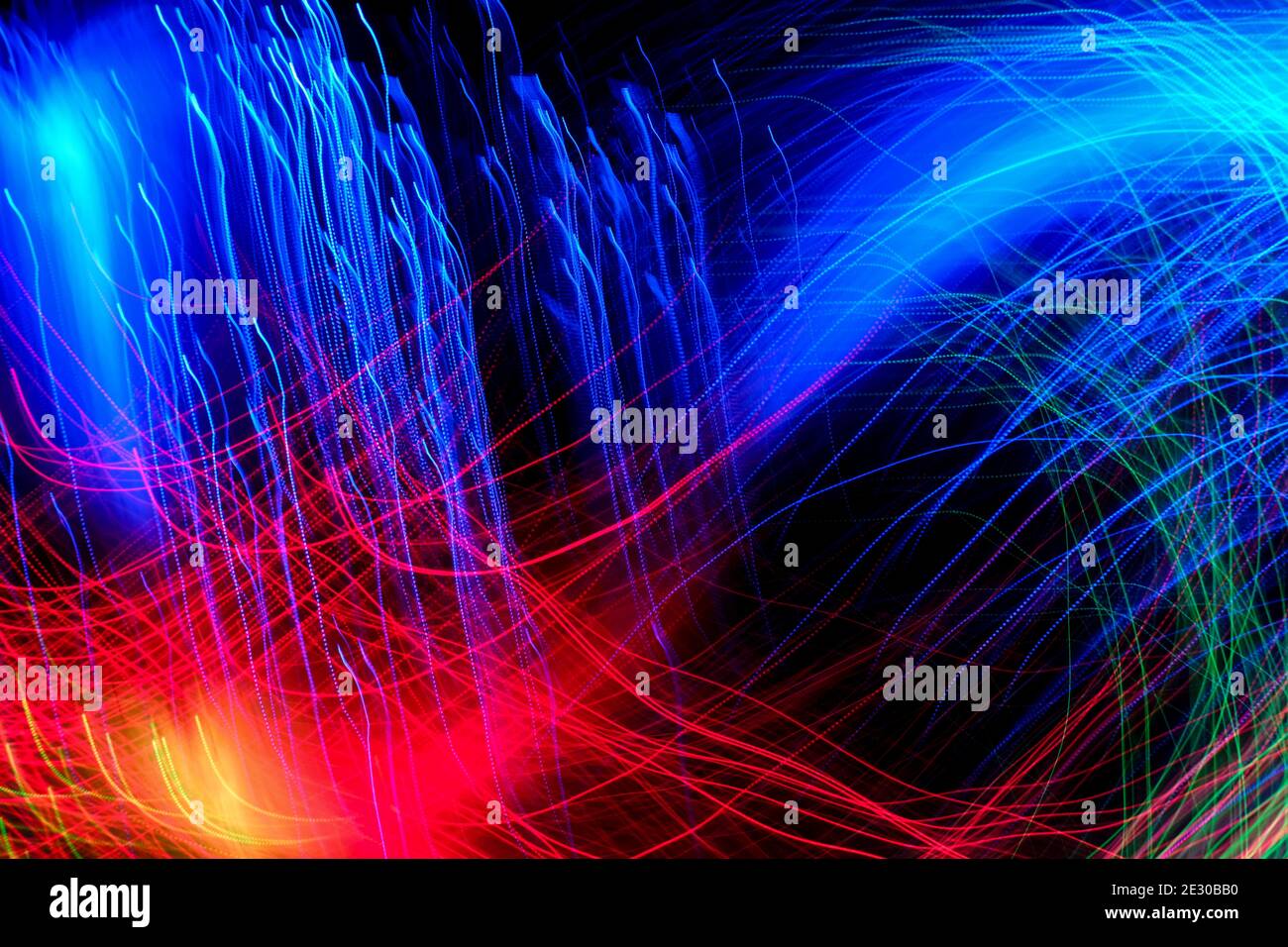 Abstract motion curved lights on dark background Stock Photo - Alamy