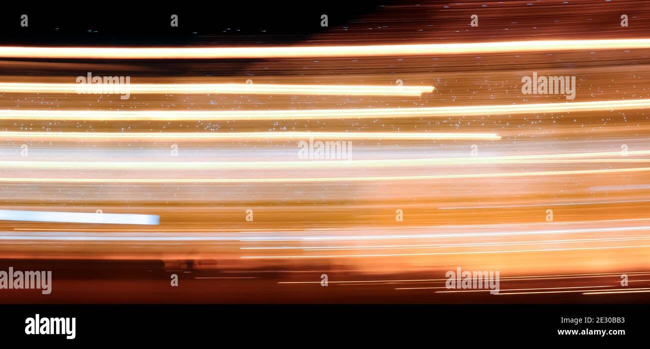 Abstract light trails on the dark background Stock Photo - Alamy