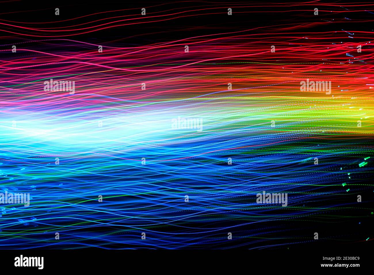 Abstract motion curved lights on dark background Stock Photo - Alamy