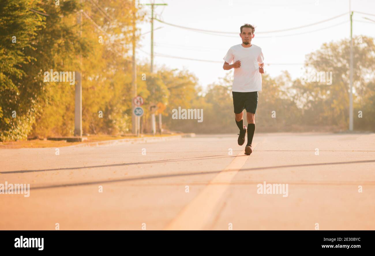 Athlete running on track sunrise hi-res stock photography and images ...