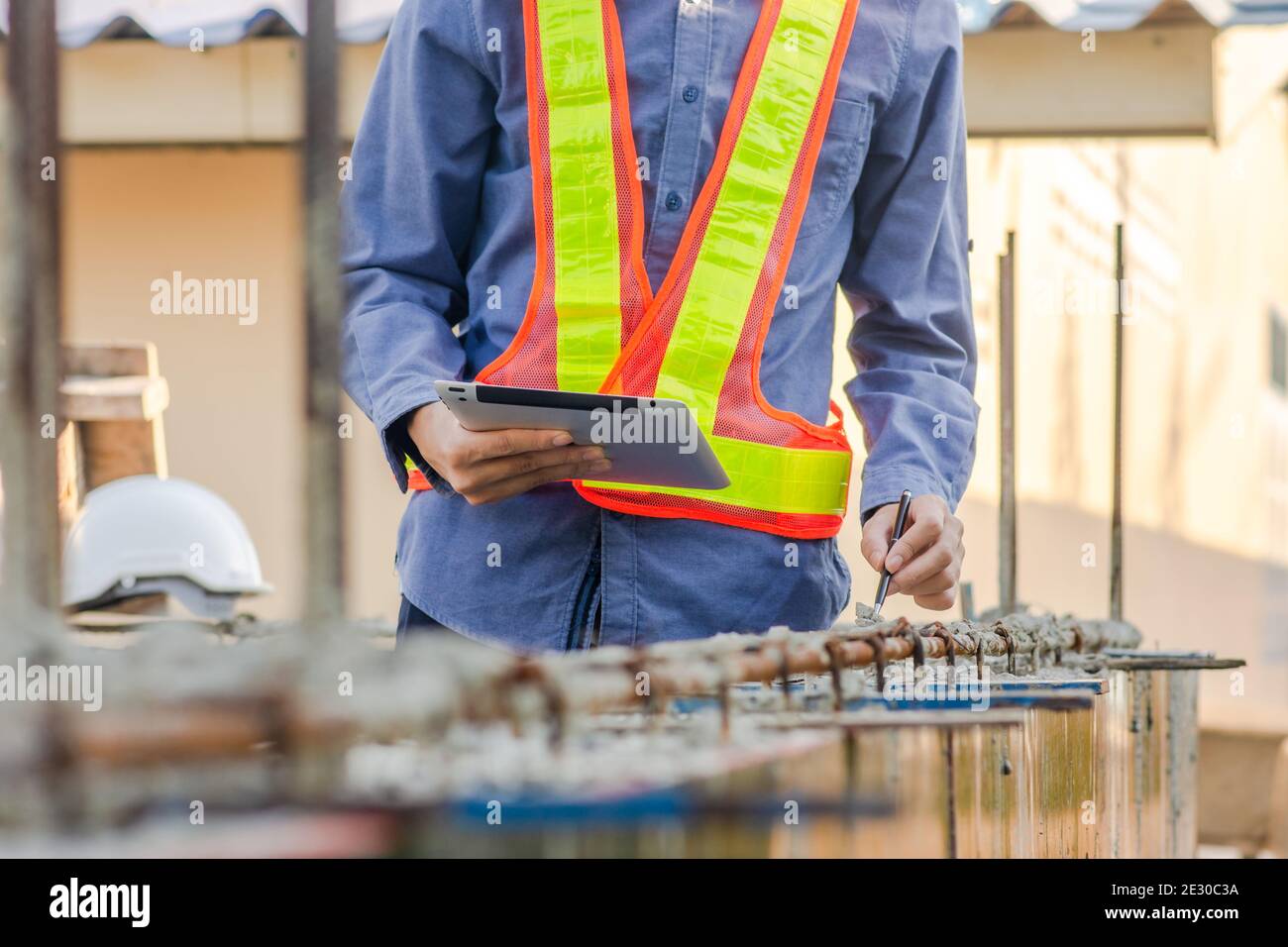 Worker Engineer construction working by tablet technology on site ...