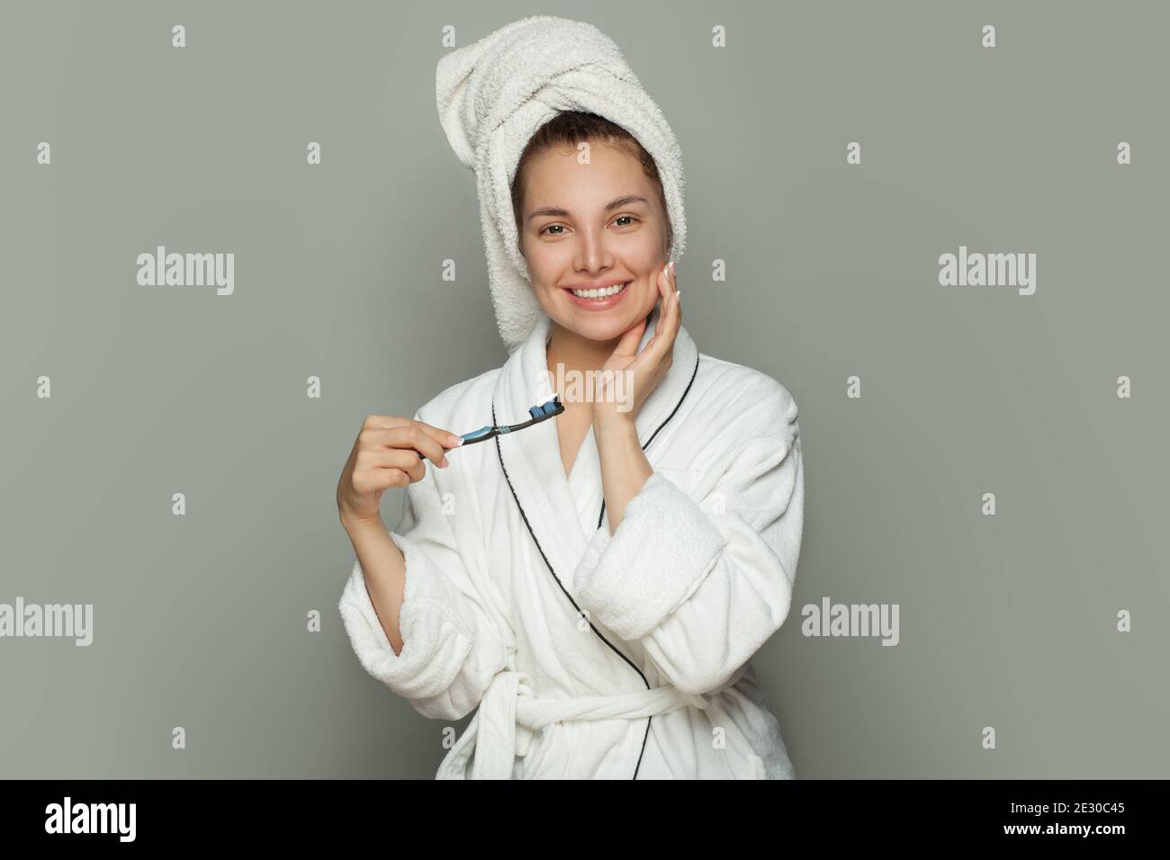 Happy spa woman with cute smile, white teeth, toothbrush and toothpaste ...