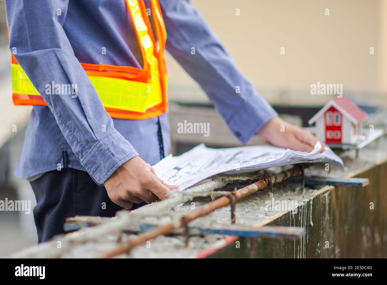 Engineer inspection on site building construction with blueprint Stock ...