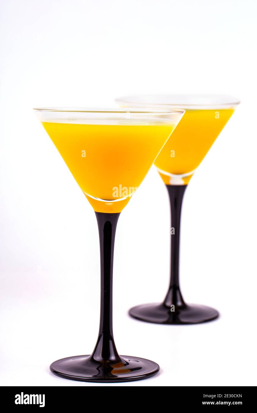 The Yellow Two Cocktail glasses in white background Stock Photo - Alamy