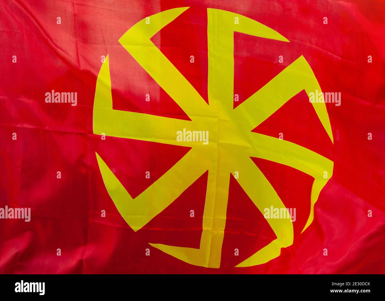 Yellow eight-pointed swastika - Kolovrat on a red background Stock ...