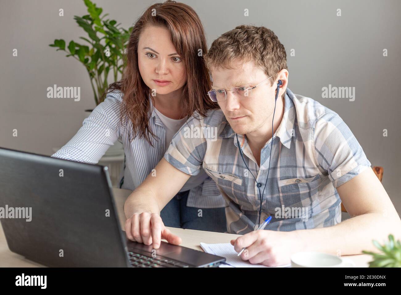 Two programmers, man and woman working from home, remote, home office ...