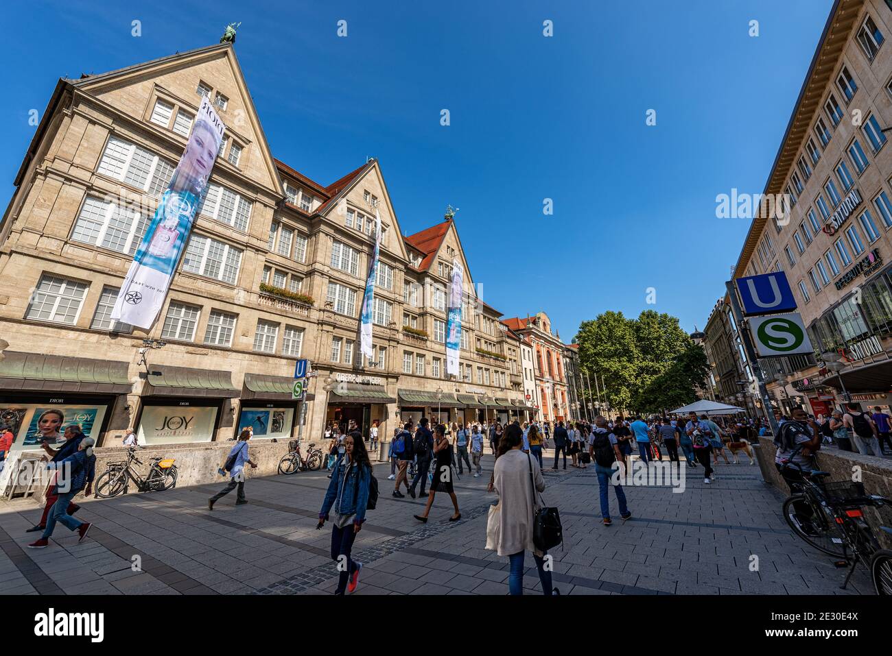 Tourists and locals walking in the Neuhauser Strasse, shopping street ...