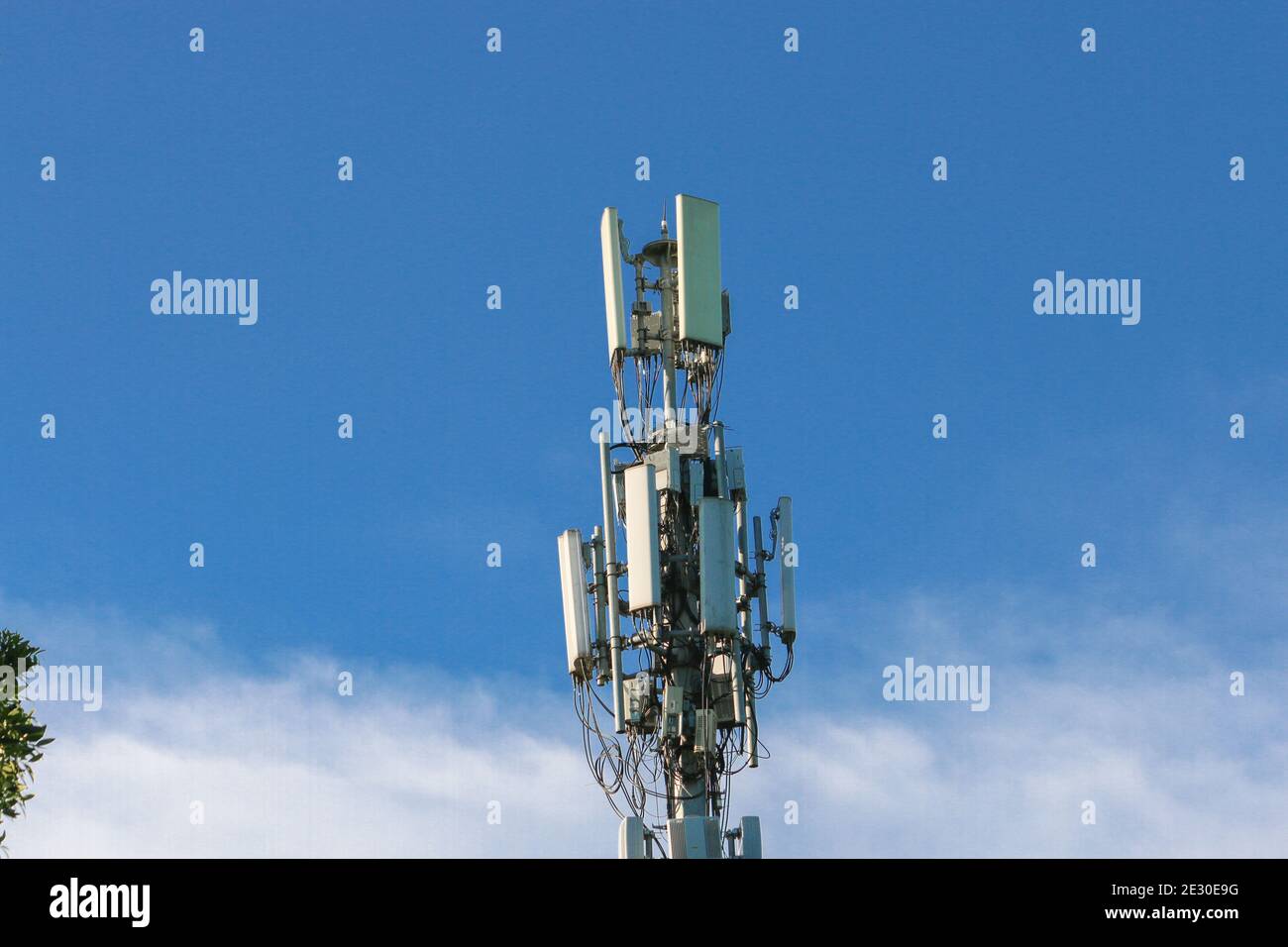 Telecommunication tower mast on sky background. Cellular telephone ...