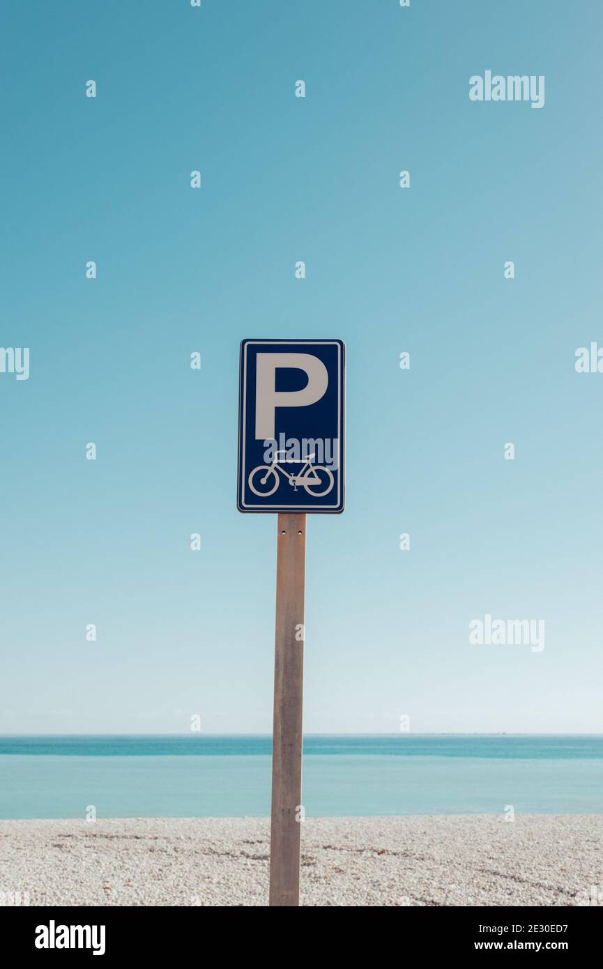 Bicycle parking sign at the beach Stock Photo - Alamy
