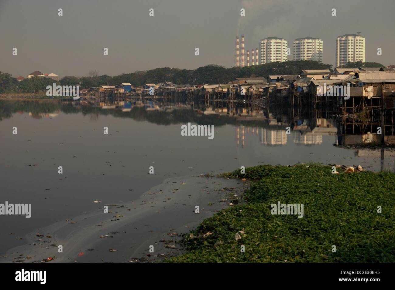 Morning scenery of Pluit water reservoir on the coastal area of Jakarta ...