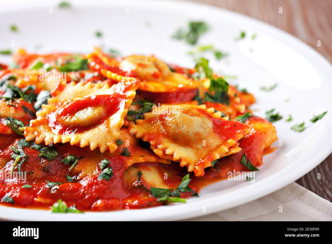 Ravioli with tomato sauce. Typical italian dish Stock Photo - Alamy