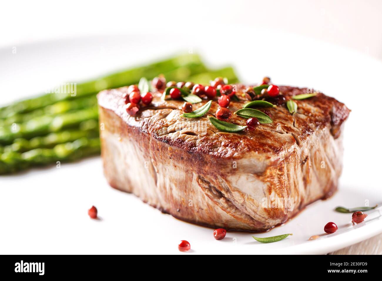 Beef Fillet With Pink Pepper and Asparagus Stock Photo - Alamy