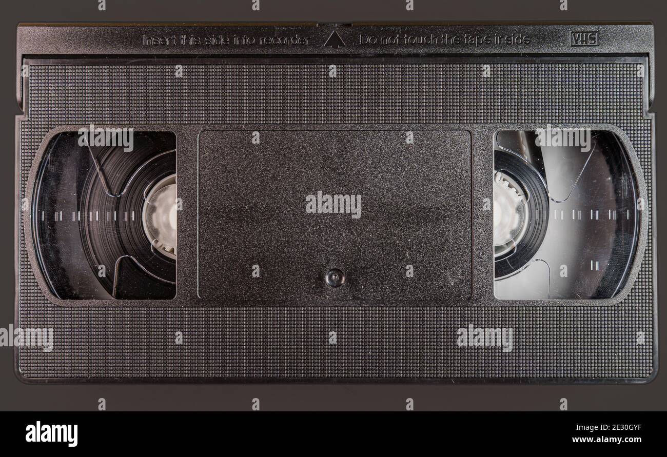 Close up view of a VHS Tape into a VCR Player Stock Photo - Alamy
